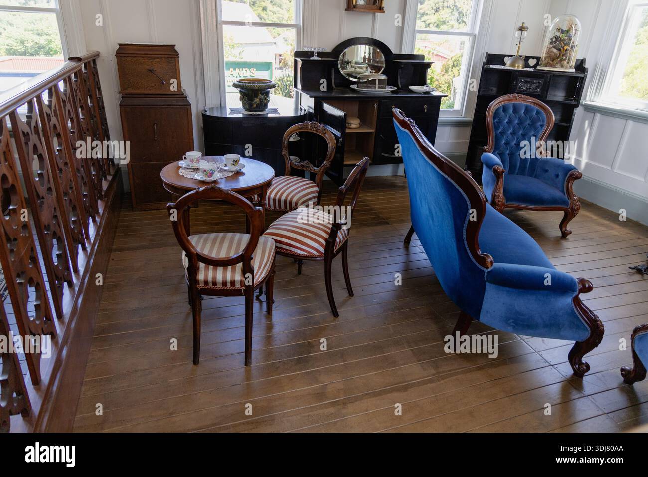 Vintage Parlor Seating Blue Sofa Wooden Floor Stock Photo - Alamy