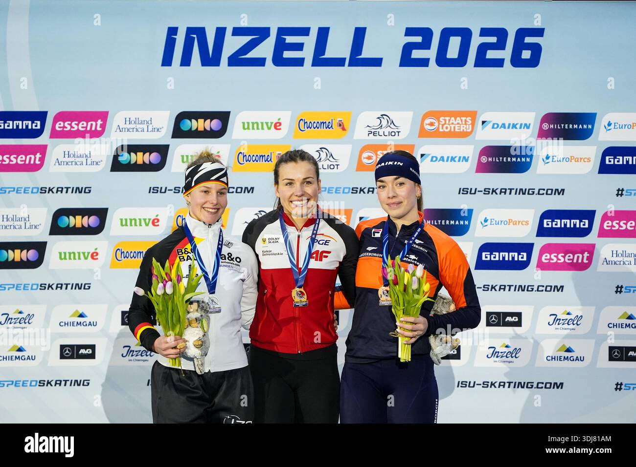 INZELL, GERMANY - JANUARY 25: Sophie Warmuth of Germany, Kaja Ziomek ...
