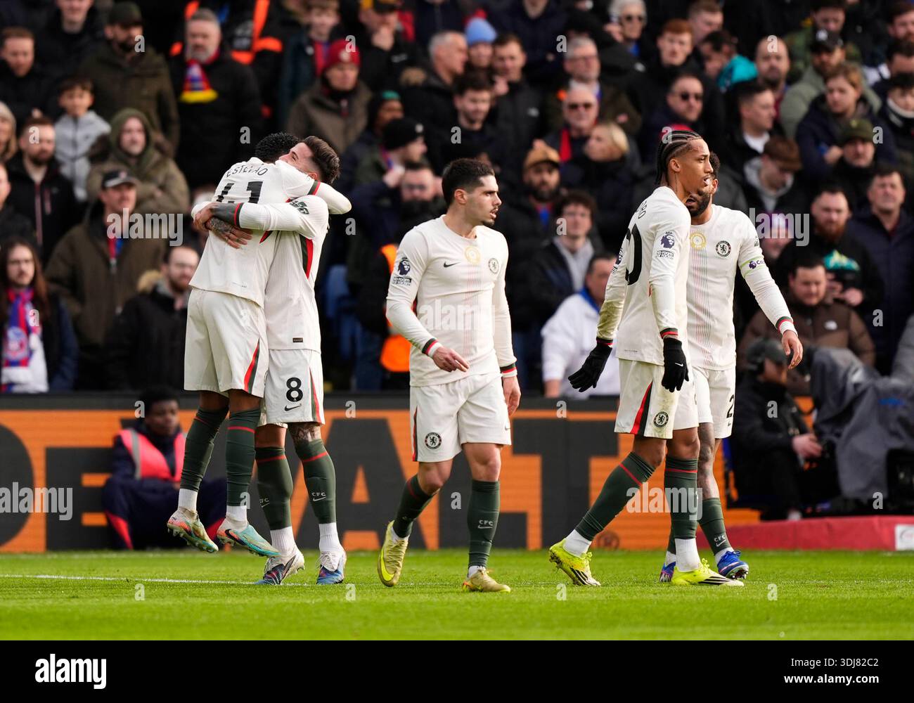 Chelsea's Estevao (left) celebrates scoring their side's first goal of ...