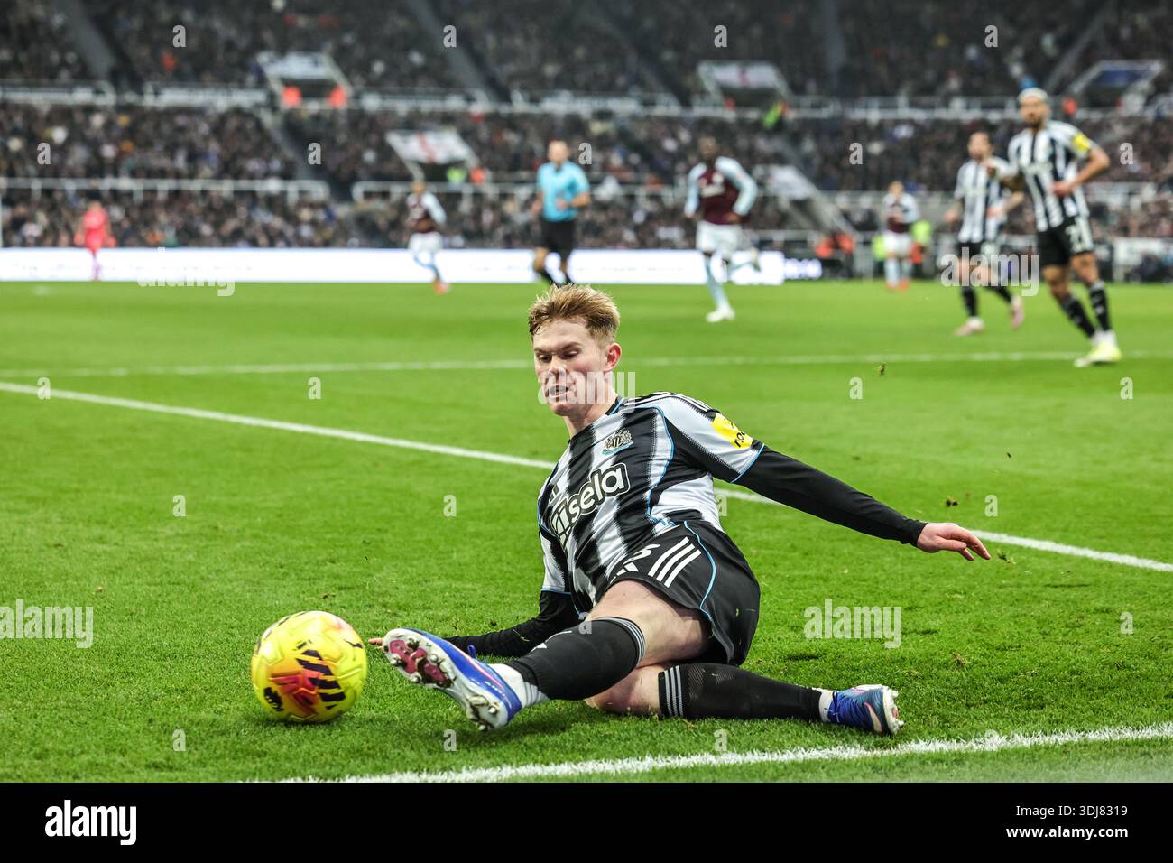 Lewis Hall of Newcastle United clears the ball during the Premier ...