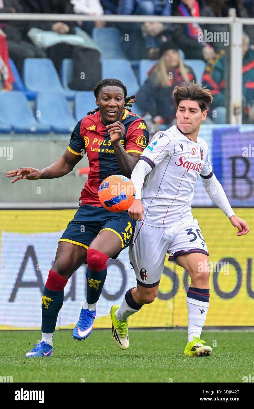Genoa's Brooke Norton-Cuffy, left, fights for the ball with Bologna's ...