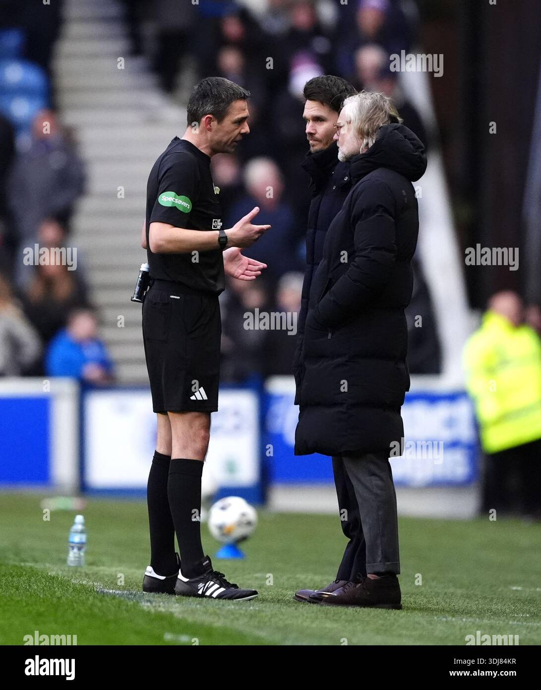 Referee Kevin Clancy addresses Rangers manager Danny Rohl and Dundee ...