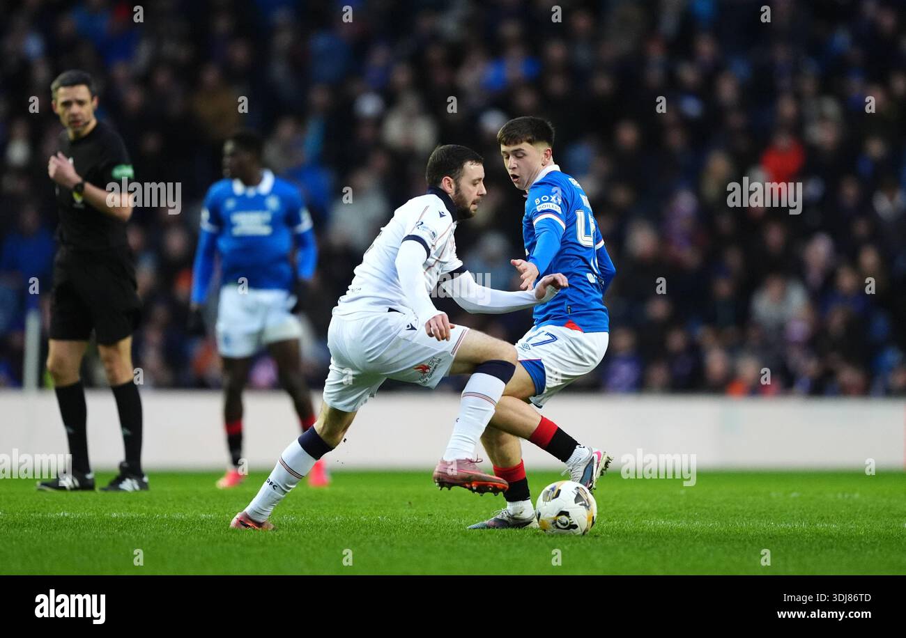 Dundee's Drey Wright and Rangers' Mikey Moore battle for the ball ...