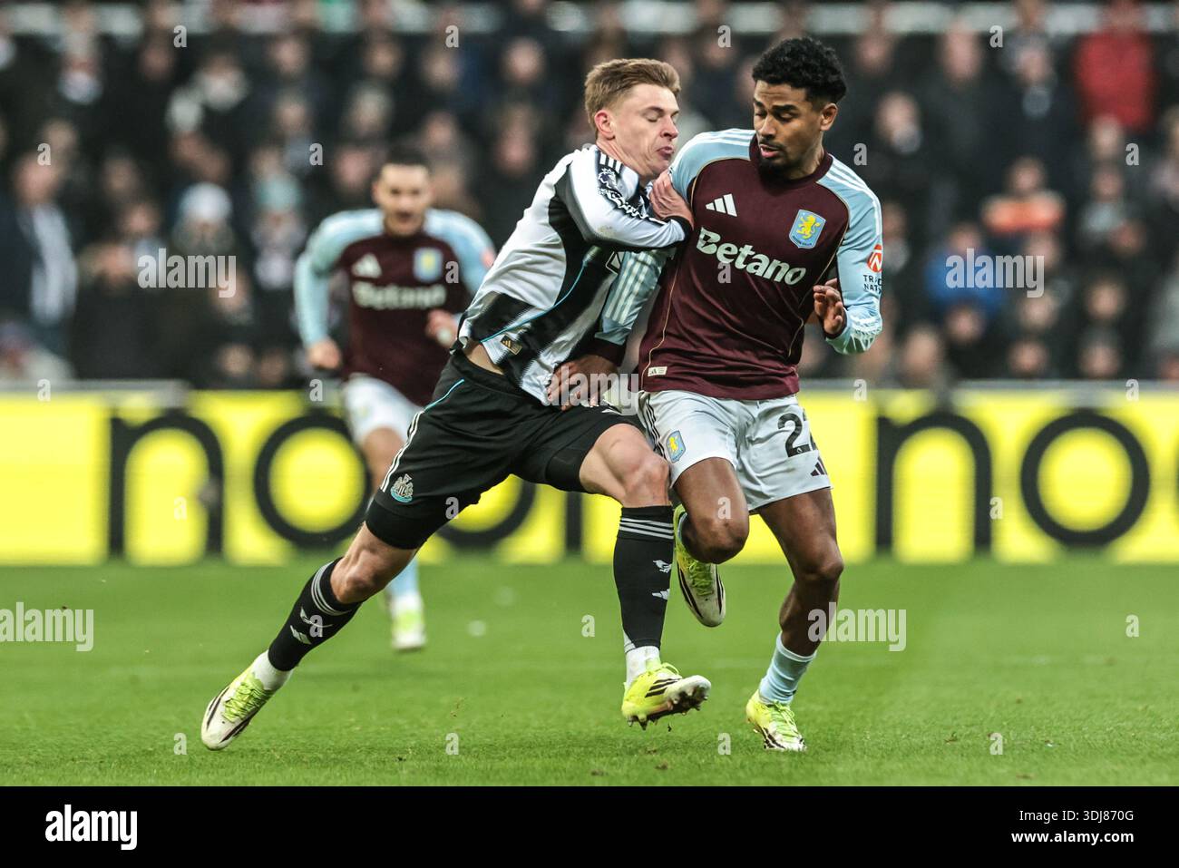 Harvey Barnes of Newcastle United fouls Ian Maatsen of Aston Villa ...