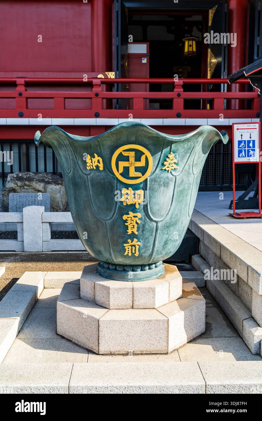 Large green bronze urn with the peace swastika symbol outside the ...