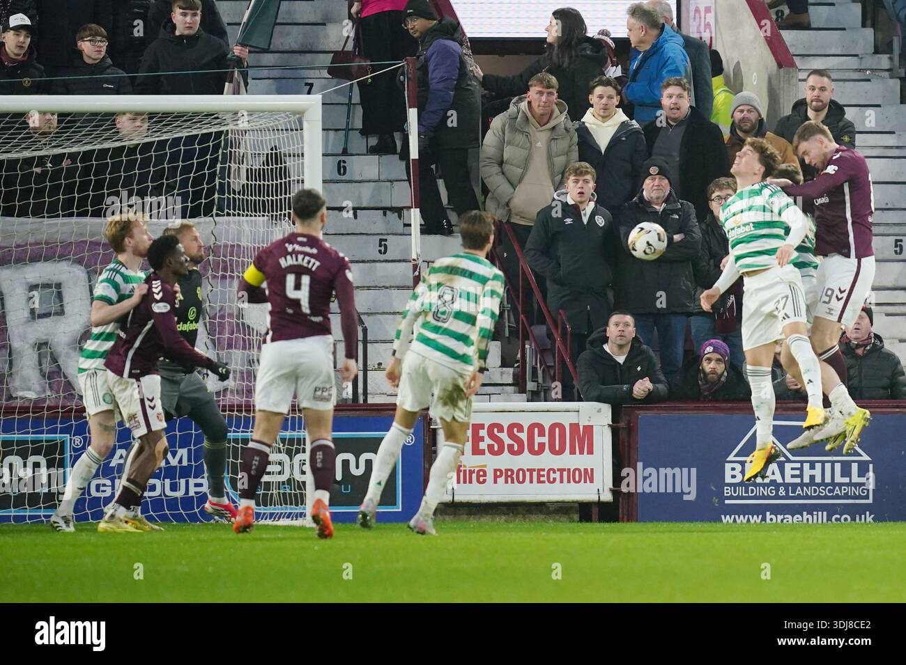 Heart of Midlothian's Stuart Findlay (right) scores their side's first ...