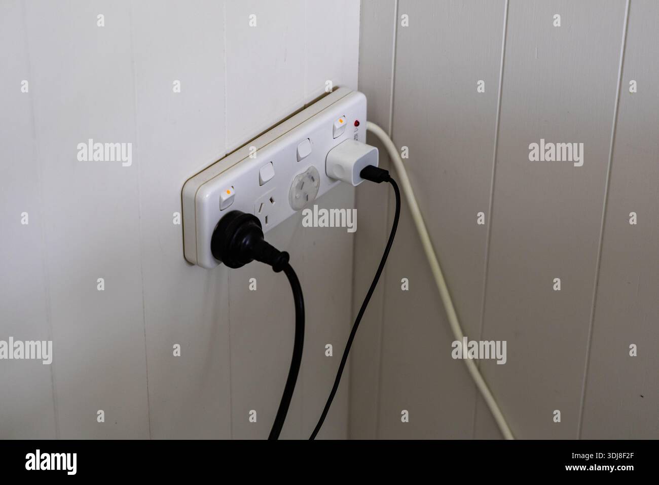 Wall Power Outlet Multiple Connected Cables Stock Photo - Alamy