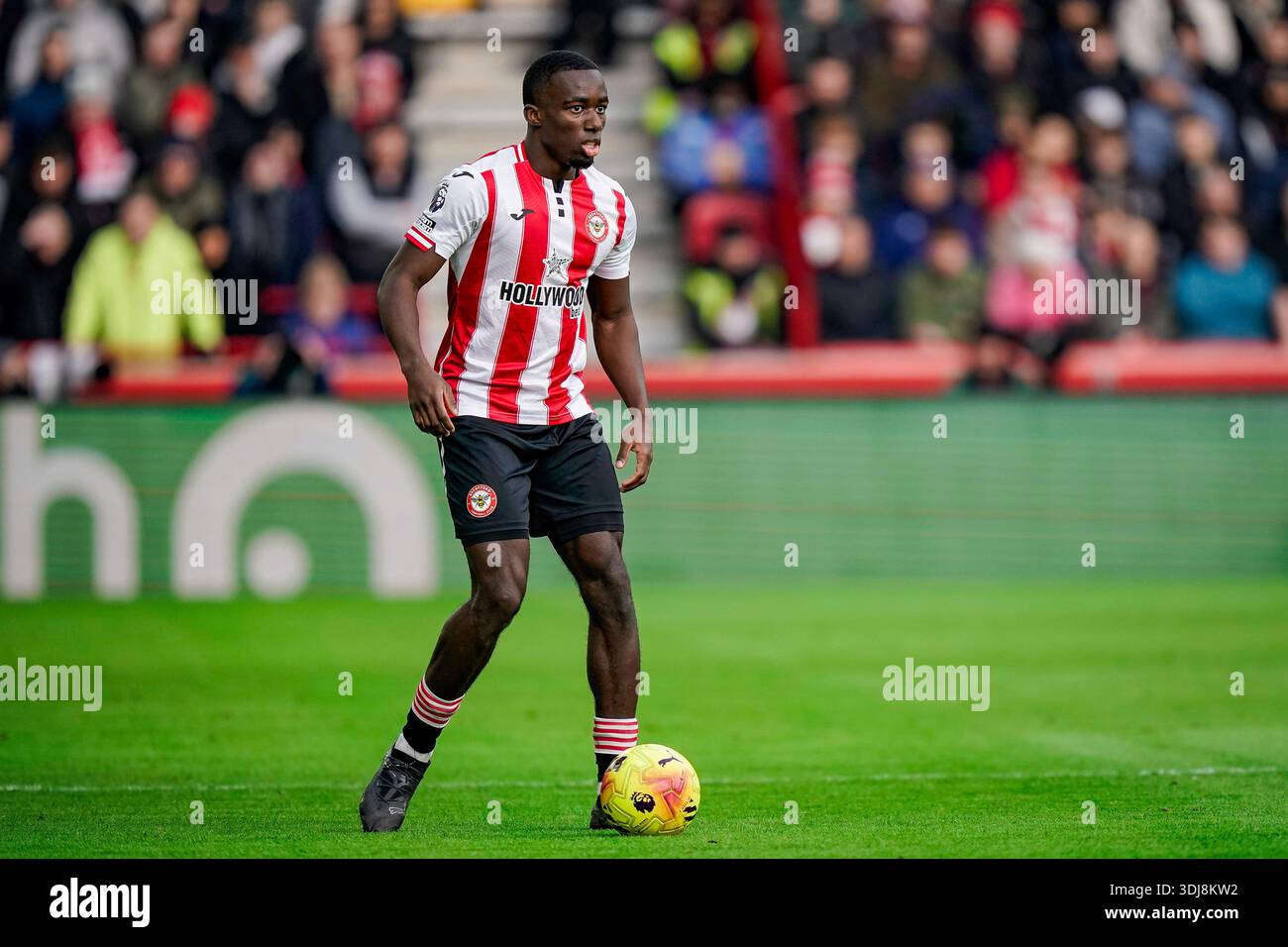 Michael Kayode of Brentford controls the ball during the Premier League ...