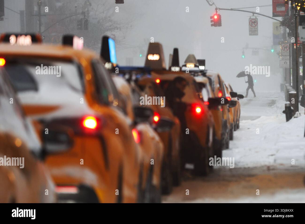 Pedestrians cross the street by Grand Central Station during a winter ...
