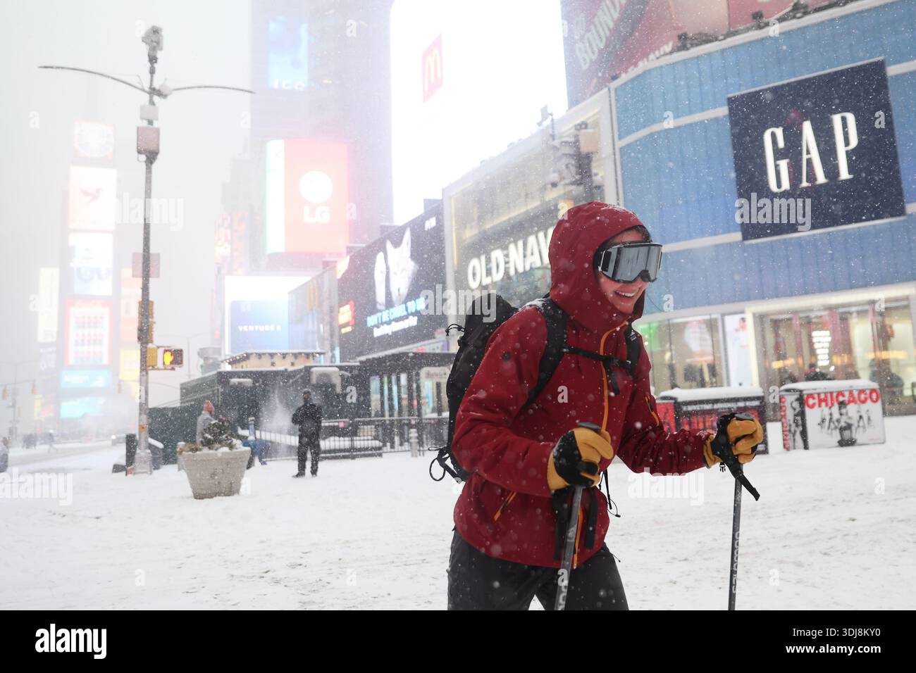 A person cross-country skis through Times Square during a winter storm ...