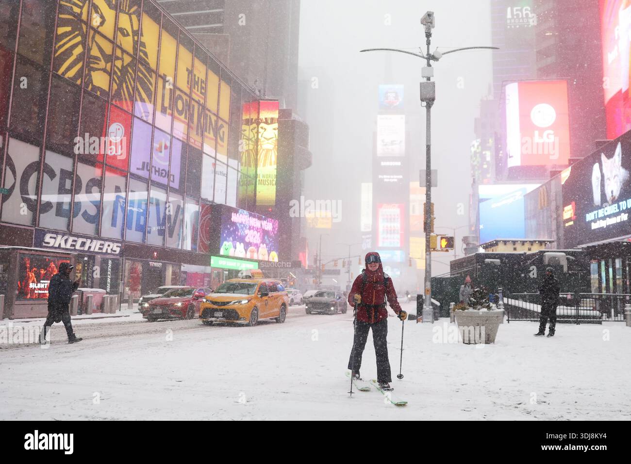 A person cross-country skis through Times Square during a winter storm ...