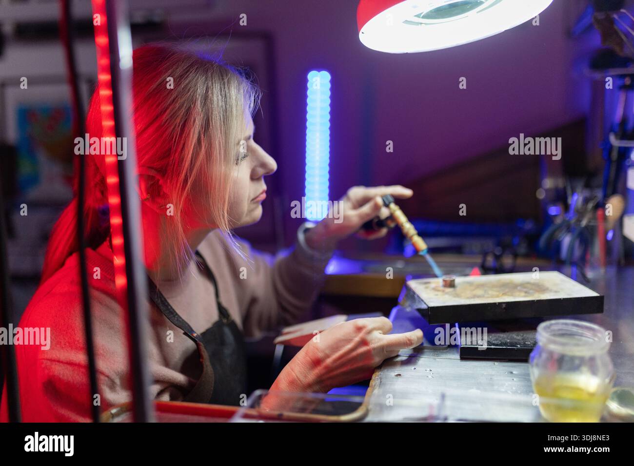 Woman jeweler soldering metal hi-res stock photography and images - Alamy