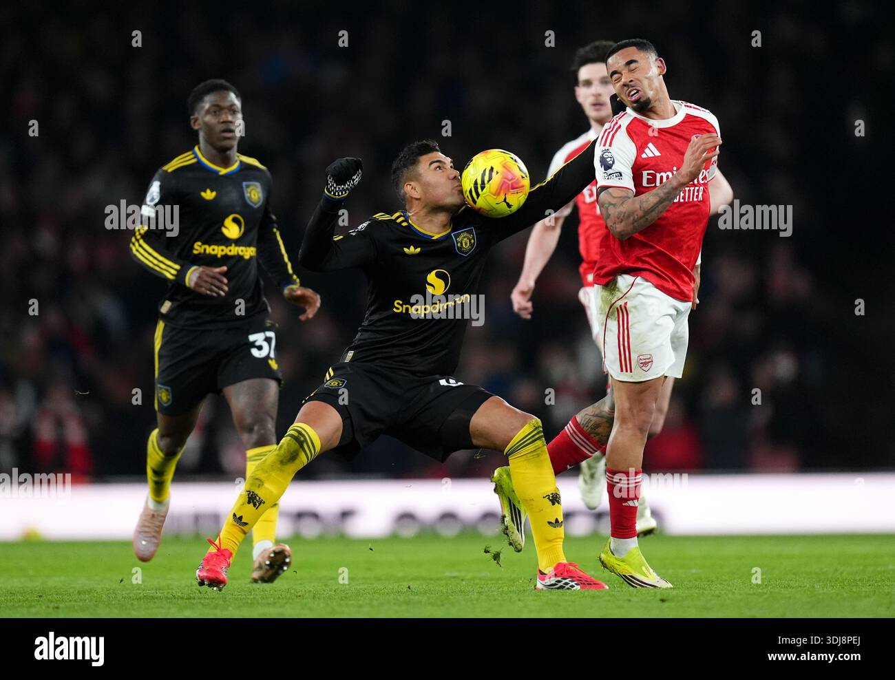 Manchester United's Casemiro (left) and Arsenal's Gabriel Jesus battle ...