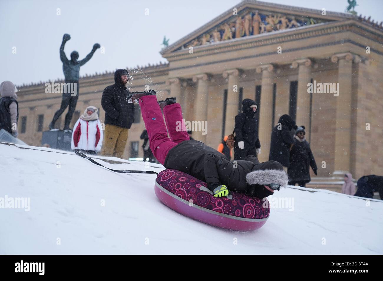 People sled at Philadelphia Art Museum steps during a winter storm in ...