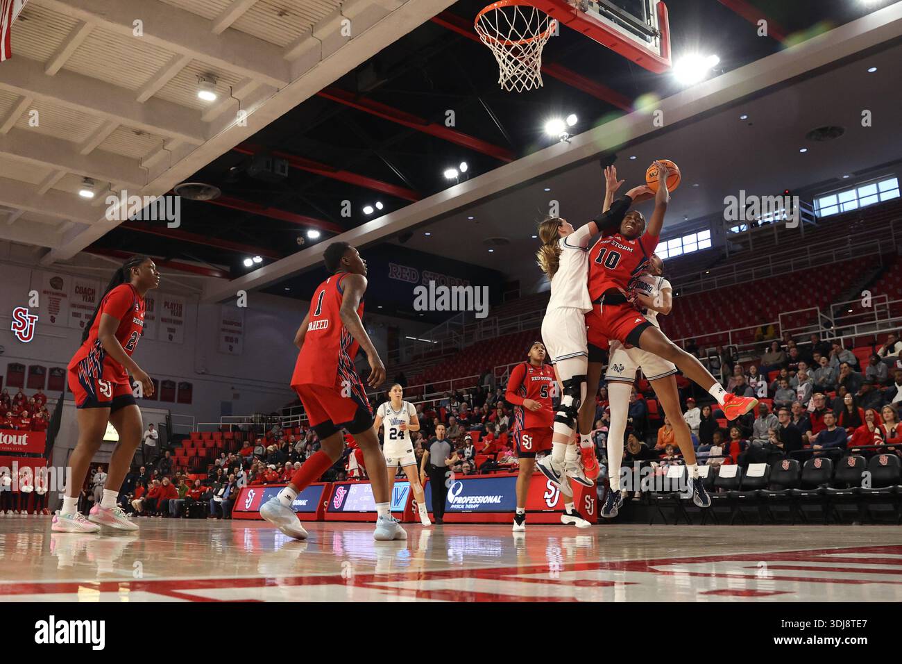 St. John's guard Brooke Moore (10) competes for a rebound with ...