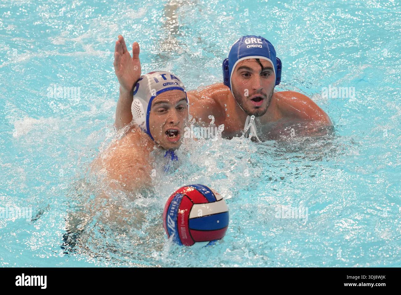 Italy's Filippo Ferrero, left, challenges for the ball with Greece's ...