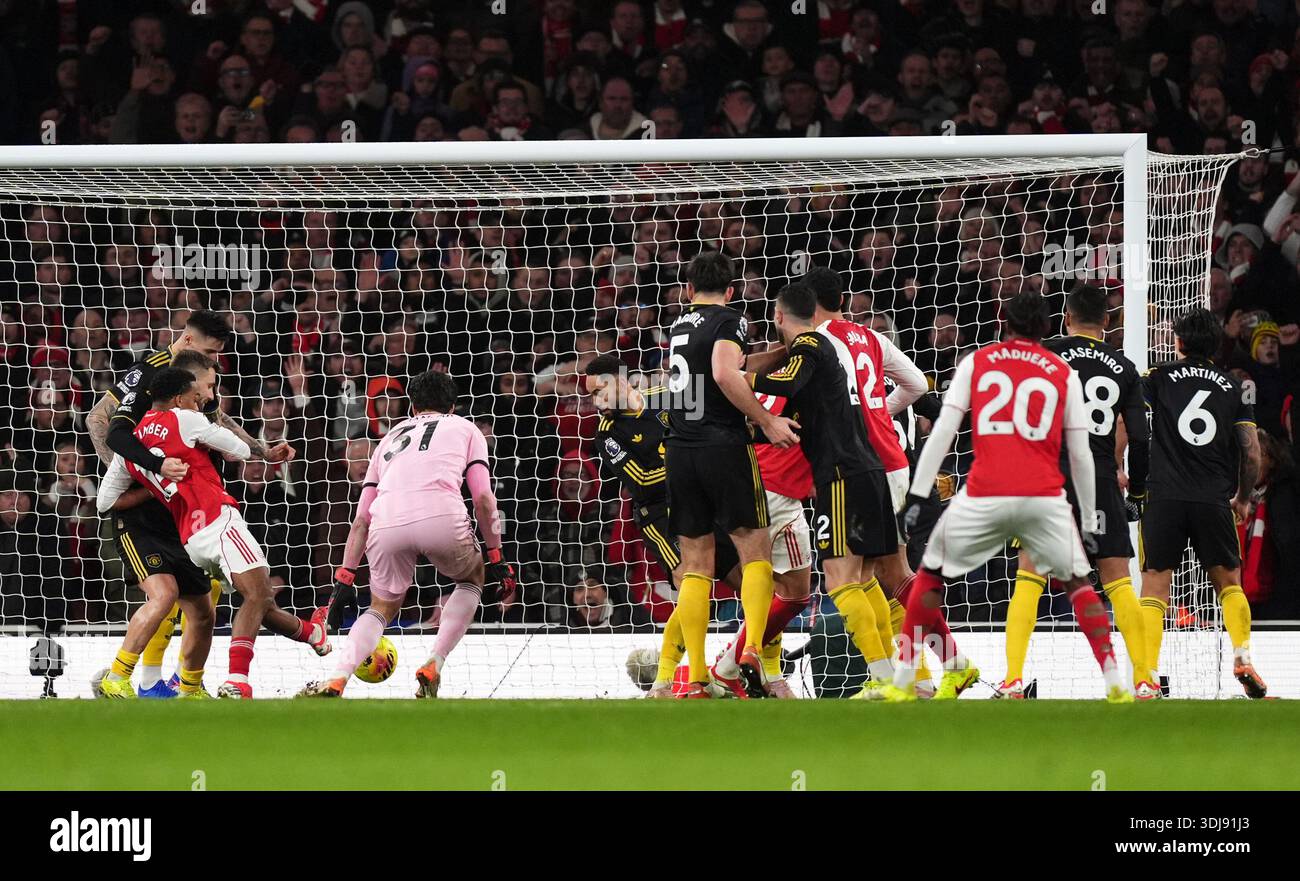 Arsenal's Mikel Merino (hidden) scores their side's second goal of the ...
