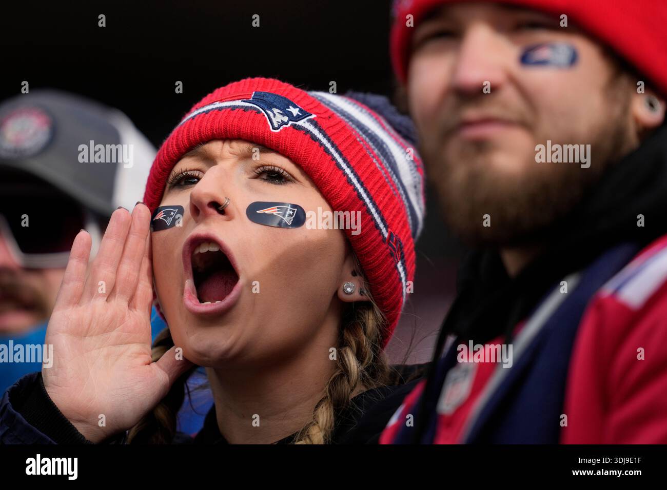 A New England Patriots fan yells prior to the AFC Championship football ...