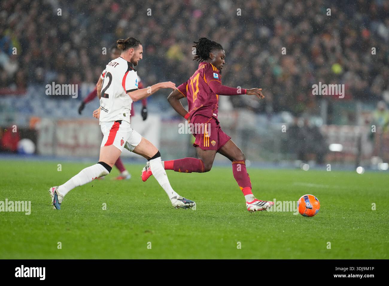 AC Milan's Adrien Rabiot, left, and Roma's Manu Kone challenge for the ...