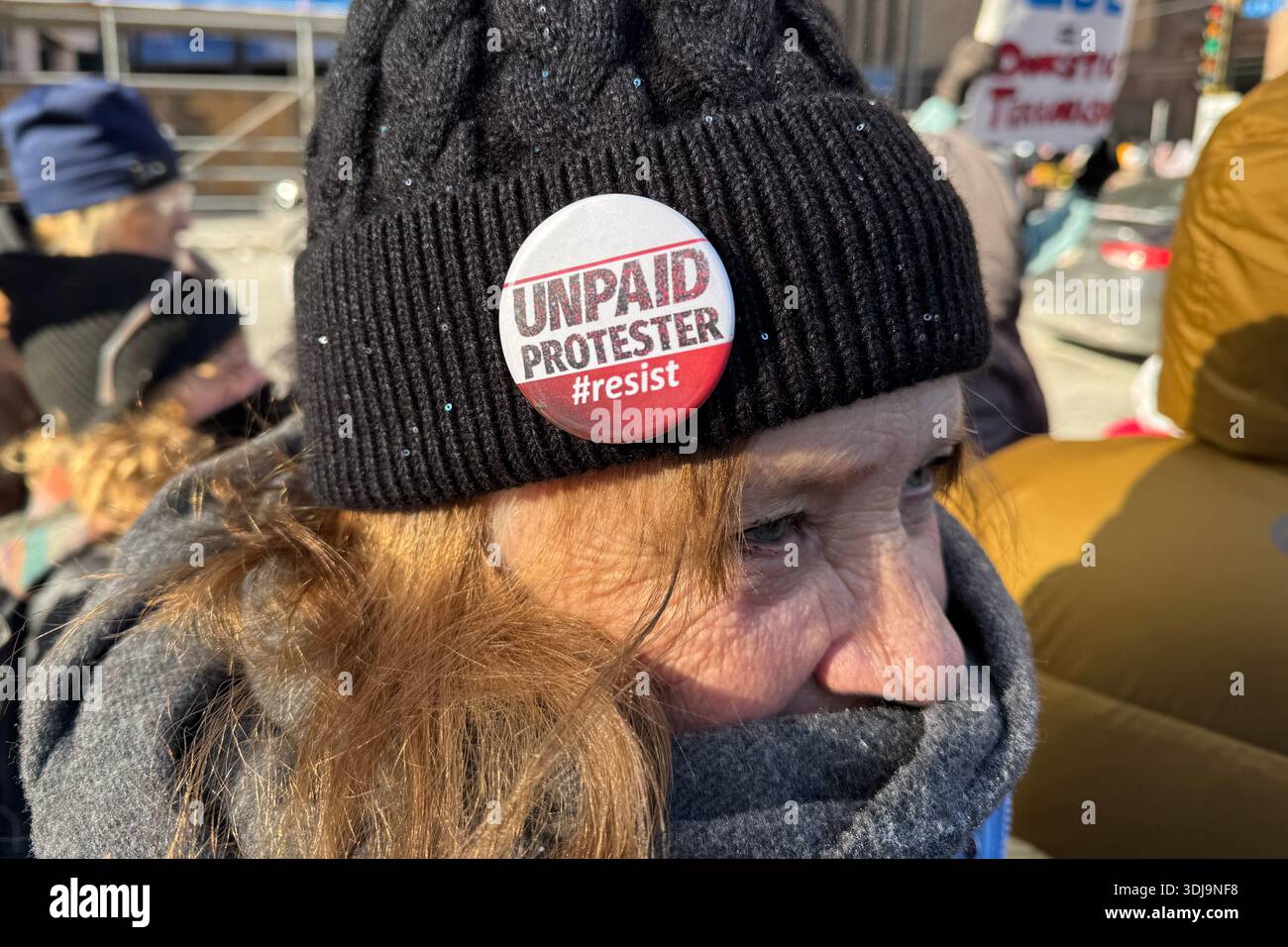 People participate in an anti-ICE rally Sunday, Jan. 25, 2026, in ...