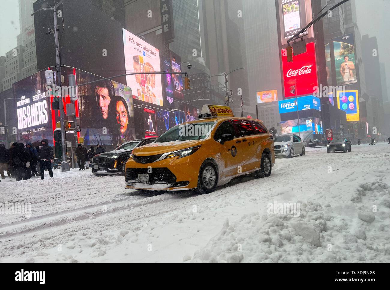 25 January 2026, USA, New York: Vehicles drive across a snow-covered ...