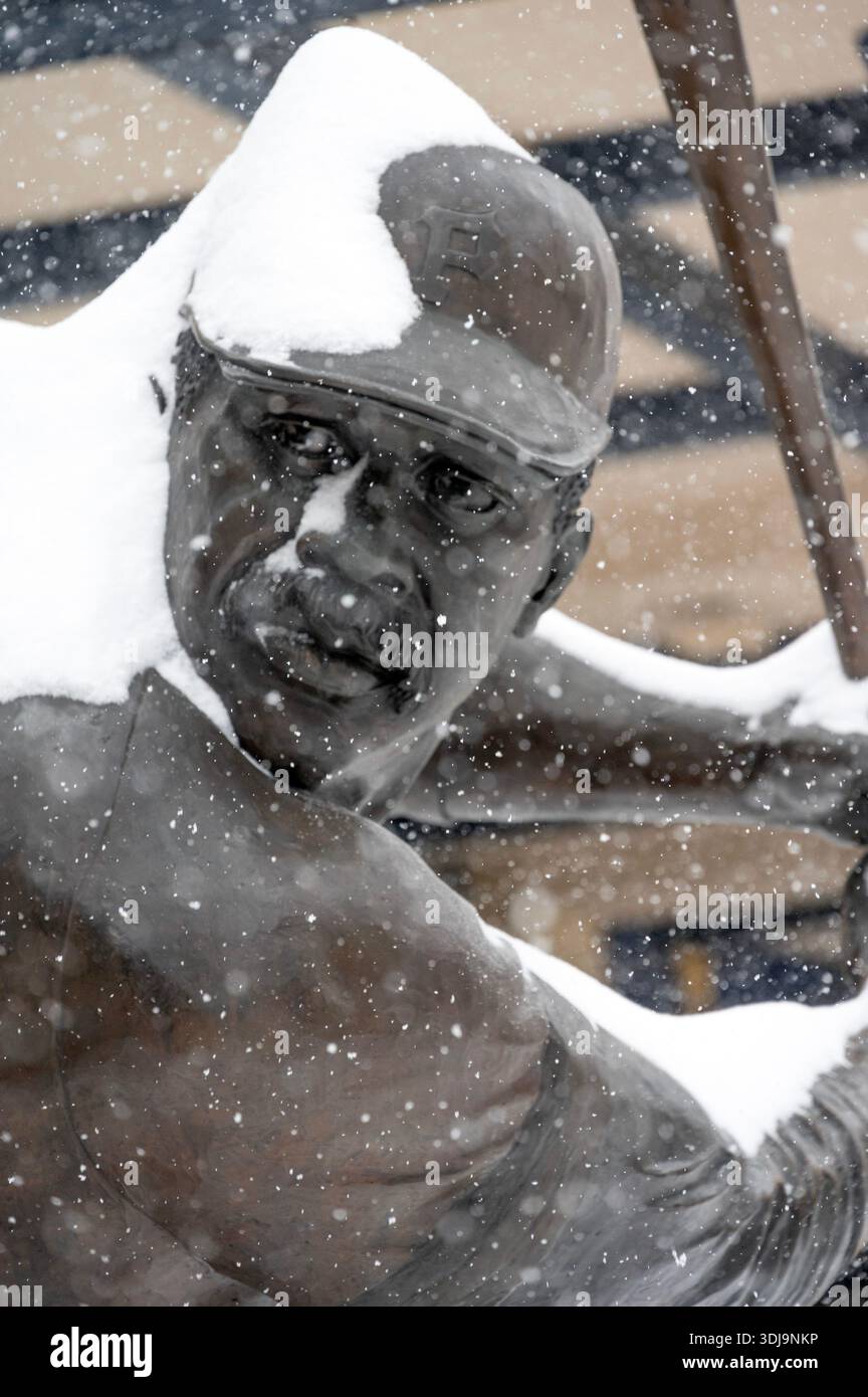 Snow falls on the statue of Willie Stargell outside of PNC Park during ...