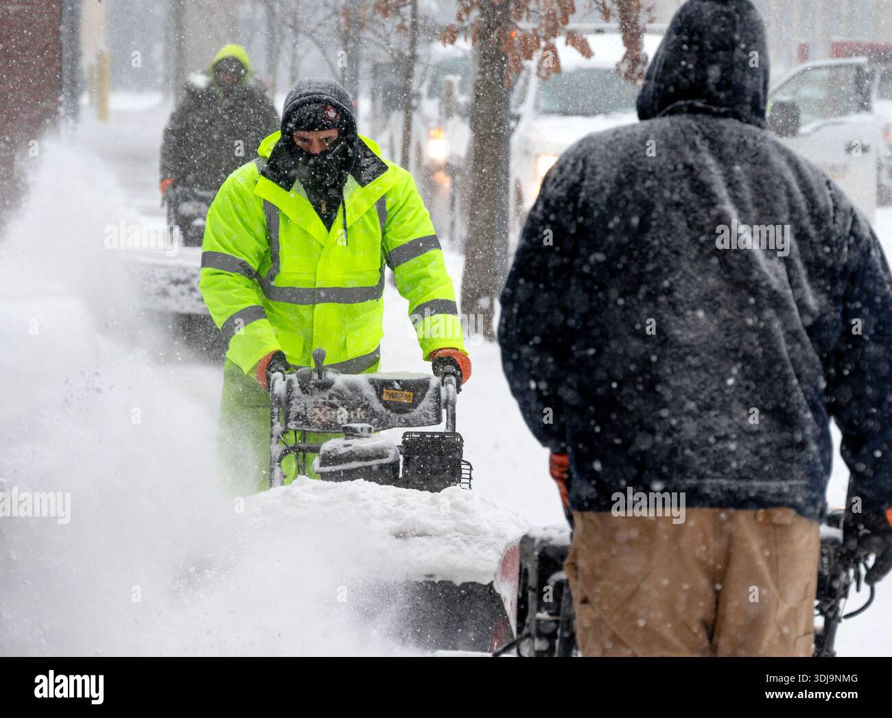 Workers of the City of Pittsburgh Public Work clear snow on the ...