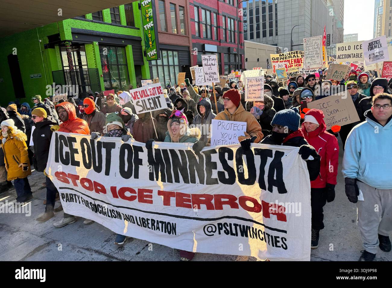 People participate in an anti-ICE rally Sunday, Jan. 25, 2026, in ...
