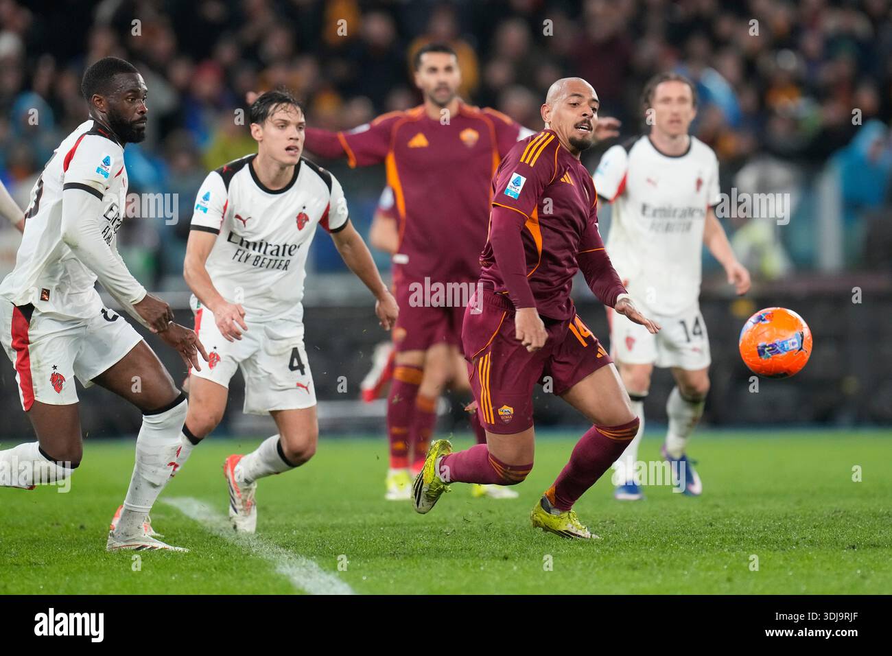 Roma's Donyell Malen, centre right, and AC Milan's Samuele Ricci ...
