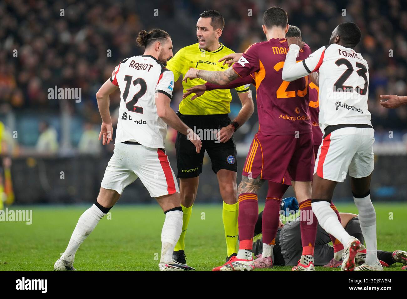 AC Milan's Adrien Rabiot, left, argues as Roma's goalkeeper Mile Svilar ...