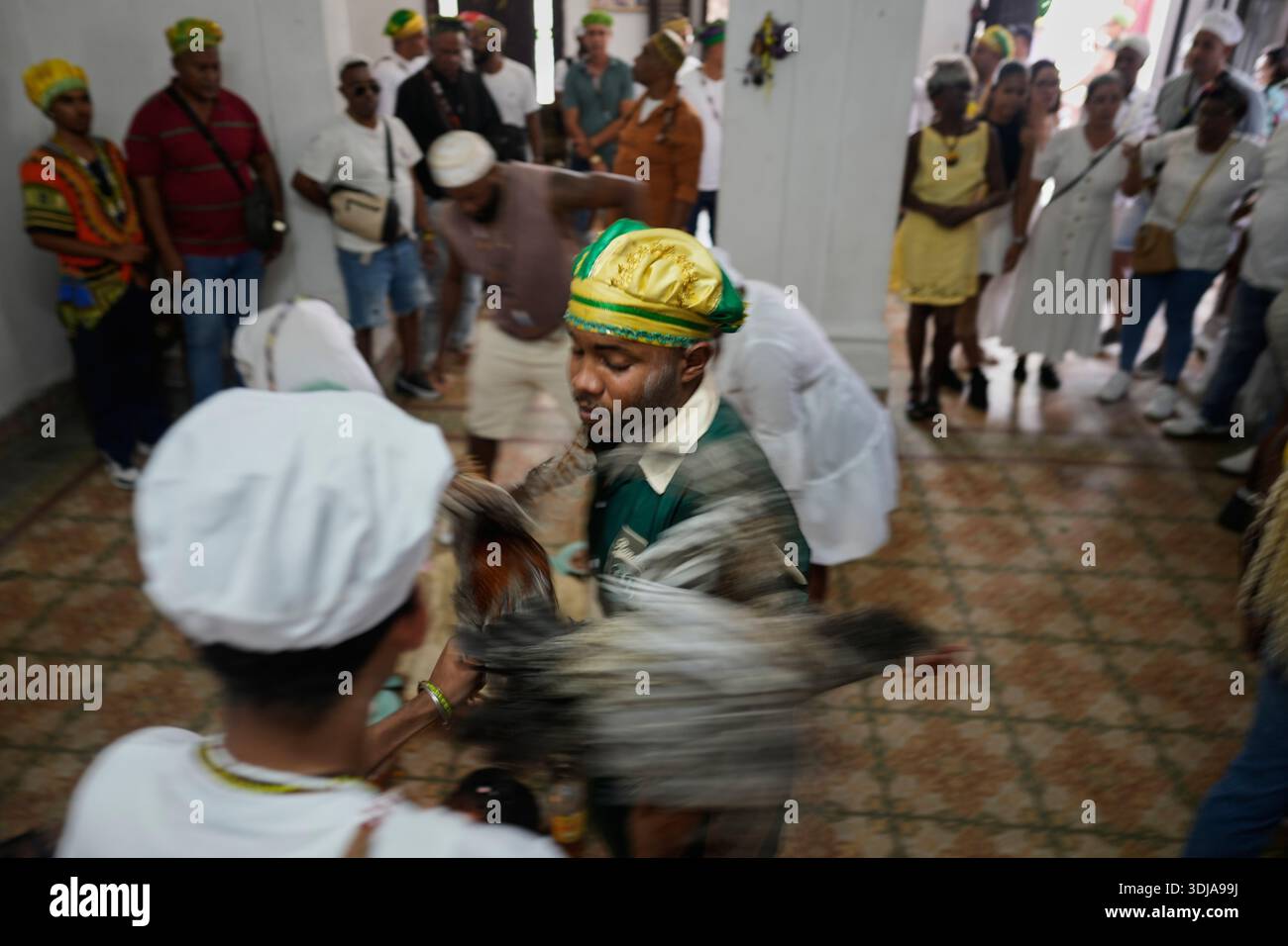 Santeria priests, also known as Babalawos, perform a cleansing ritual ...