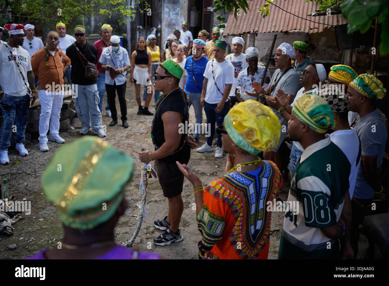 Santeria priests, also known as Babalawos, perform a cleansing ritual ...