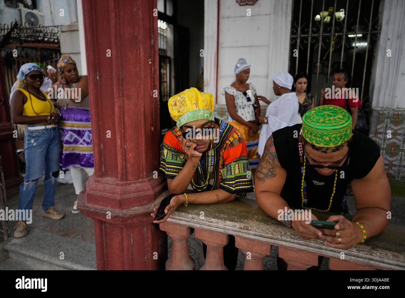 Santeria priests, also known as Babalawos, rest after a cleansing ...