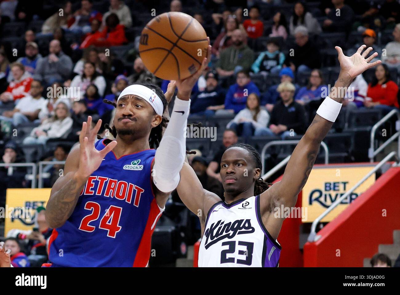 Detroit Pistons guard Daniss Jenkins (24) passes the ball away from ...