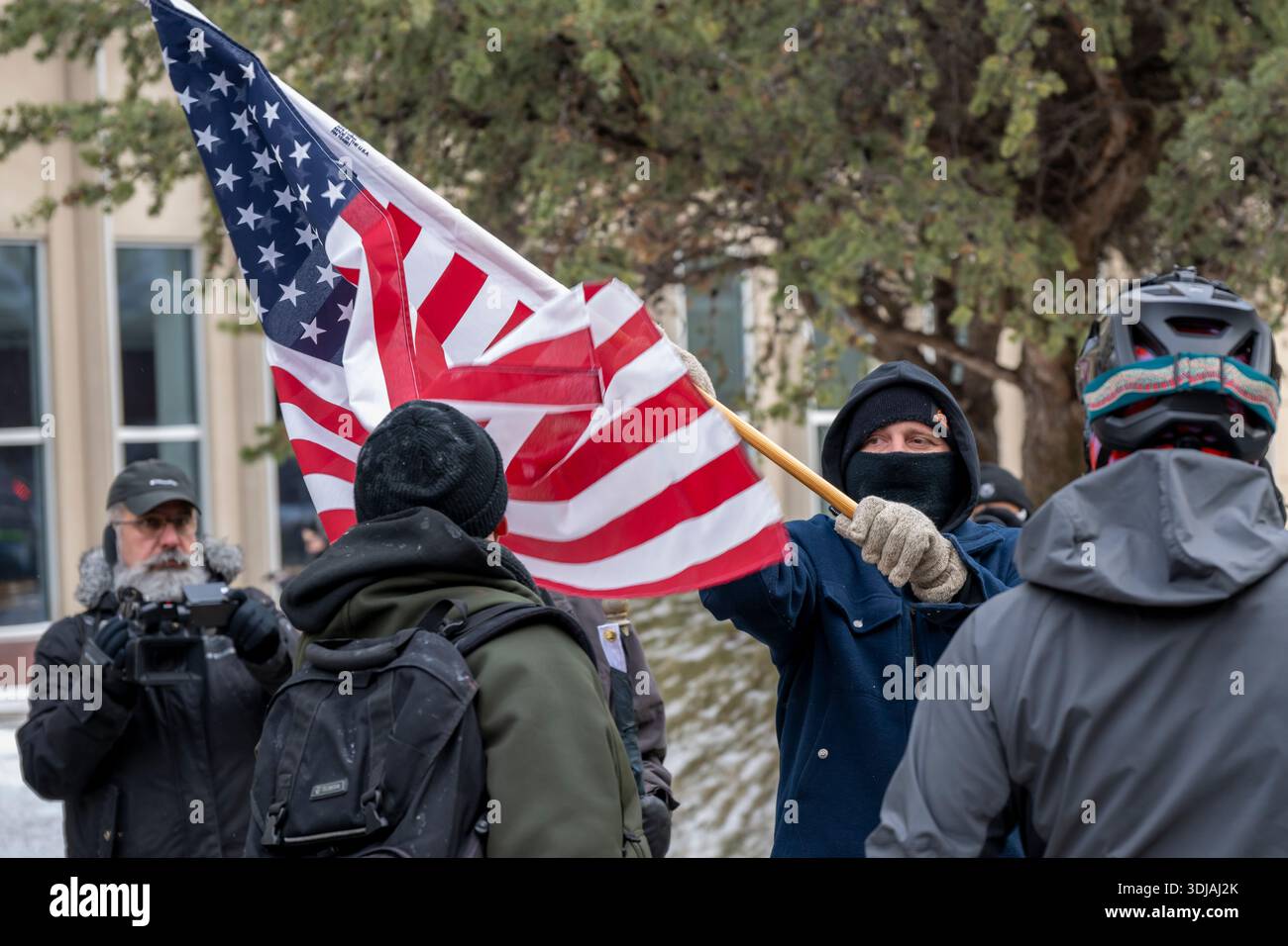 Minneapolis, Minnesota. January 17, 2026. Pro-ice protester waving the ...