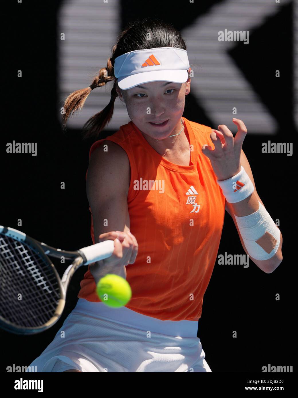 Wang Xinyu of China plays a forehand return to Amanda Anisimova of the ...