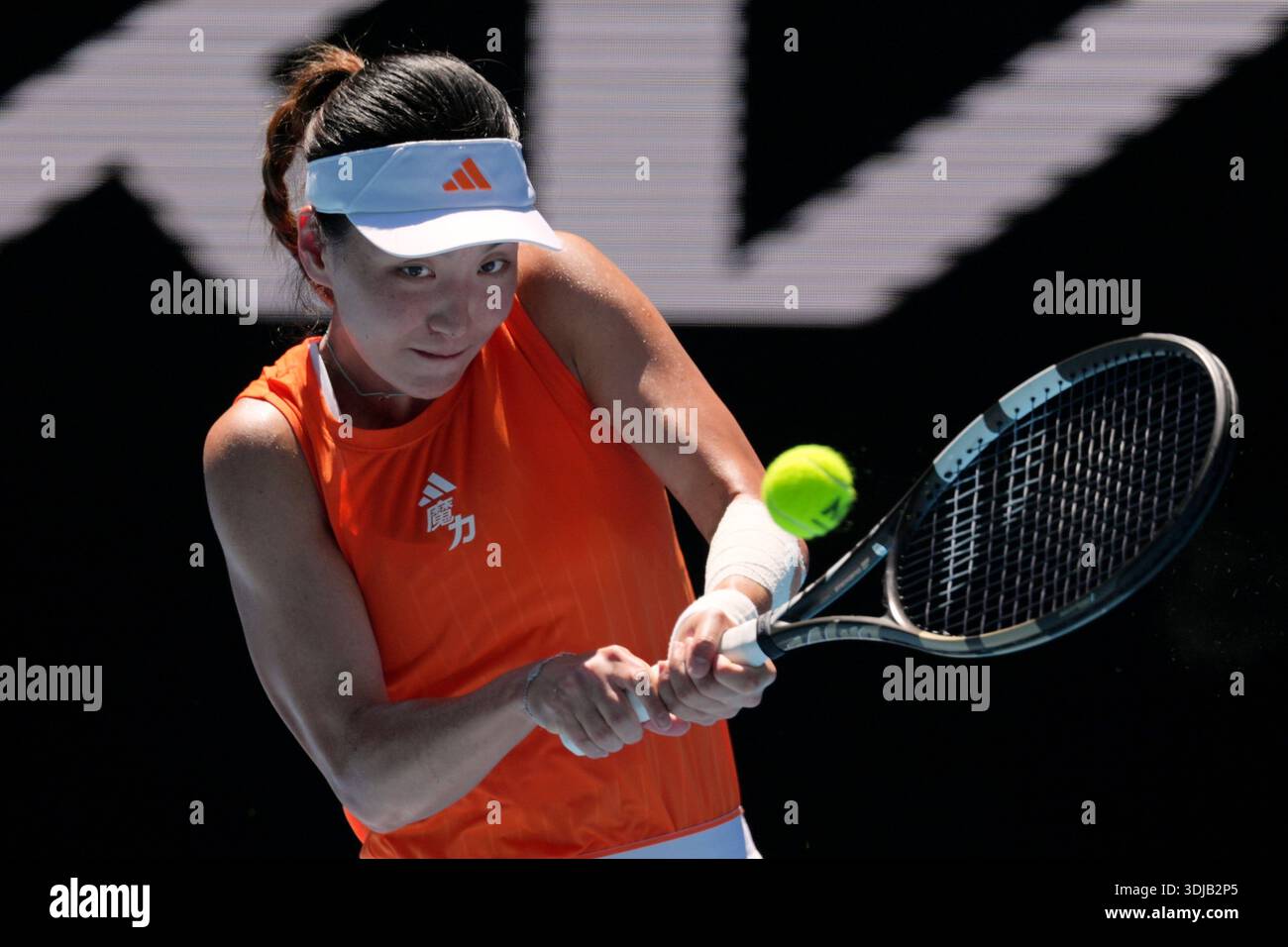 Wang Xinyu of China plays a plays a backhand return to Amanda Anisimova ...