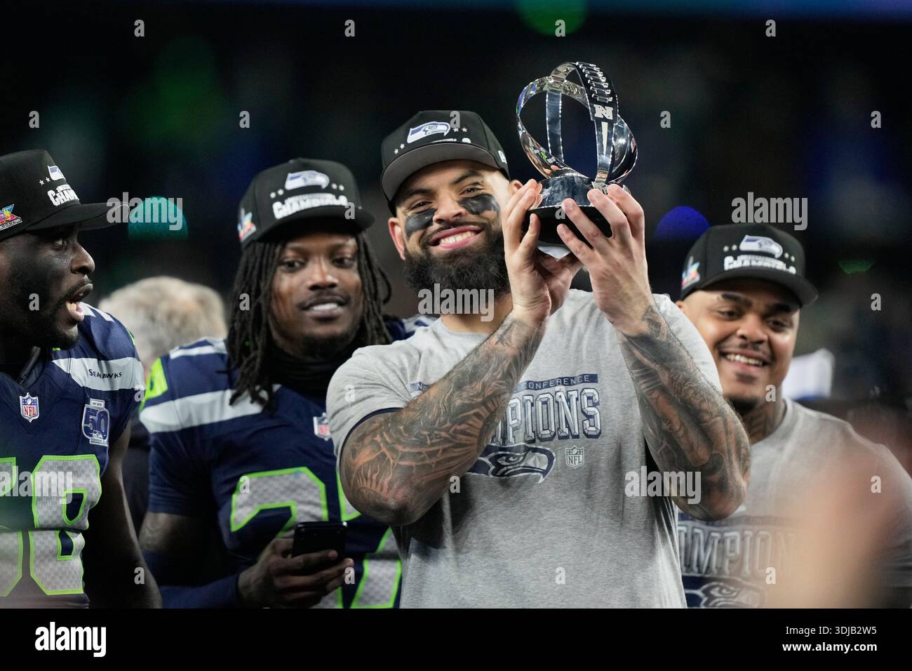 Seattle Seahawks offensive tackle Abraham Lucas, foreground, celebrates ...