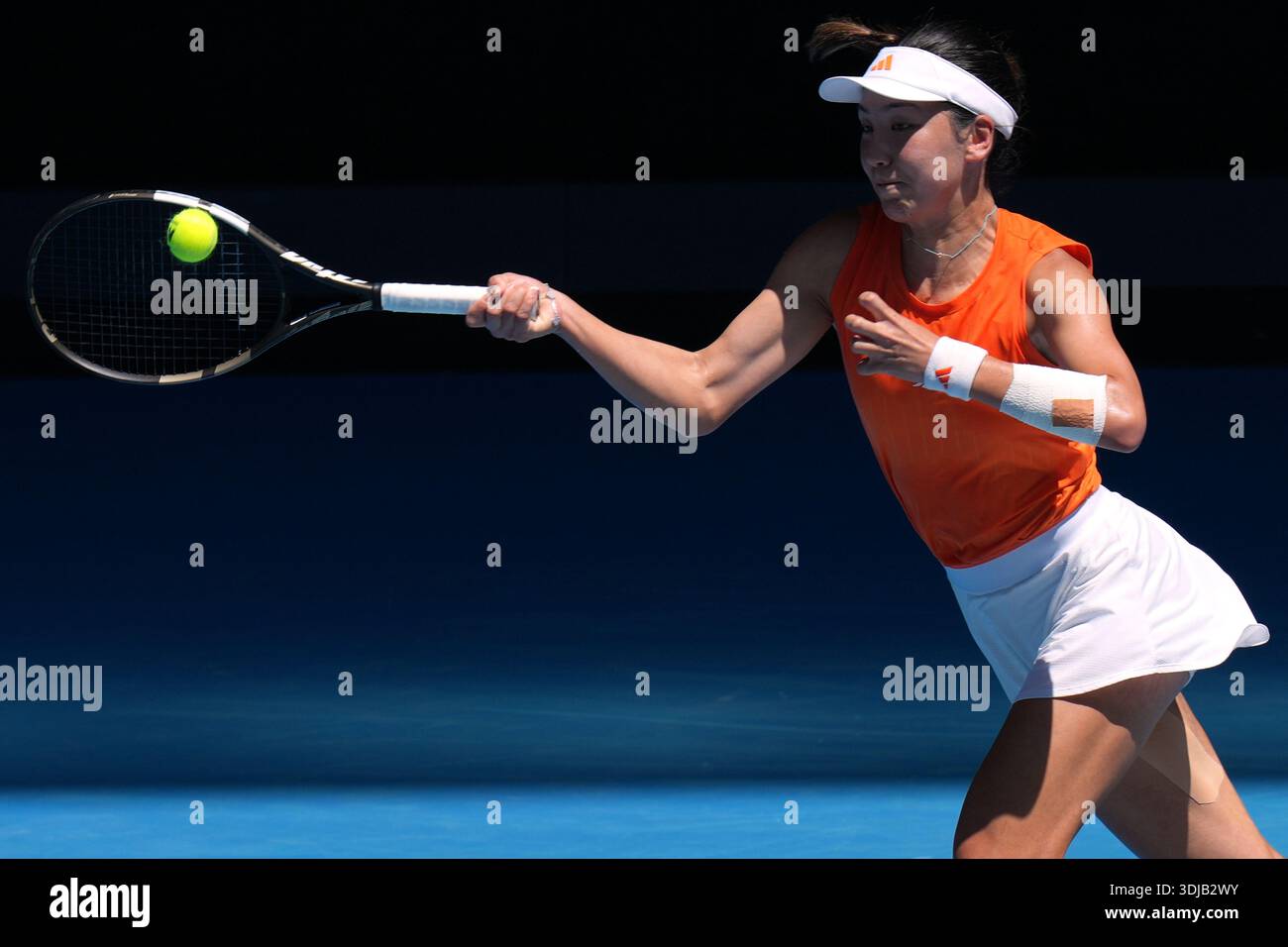 Wang Xinyu of China plays a forehand return to Amanda Anisimova of the ...