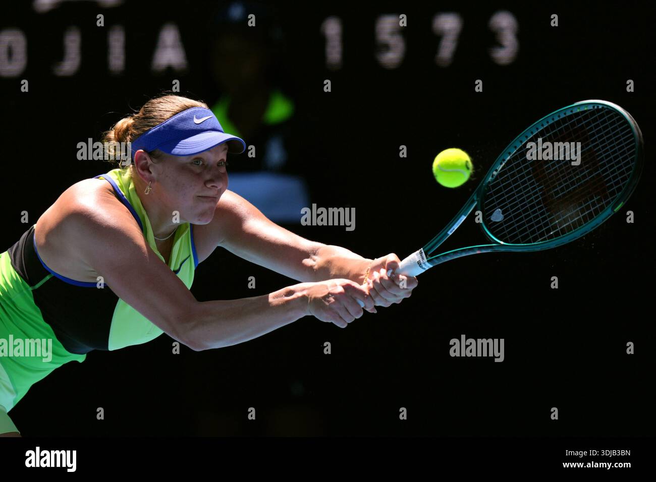 Amanda Anisimova of the U.S. plays a backhand return to Wang Xinyu of ...