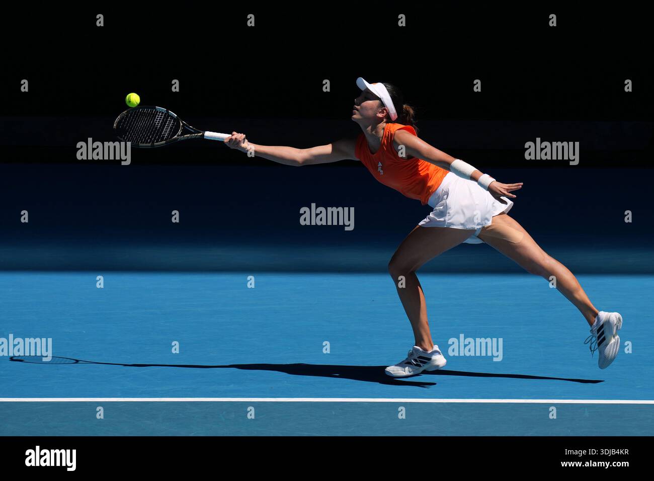 Wang Xinyu of China plays a forehand return to Amanda Anisimova of the ...