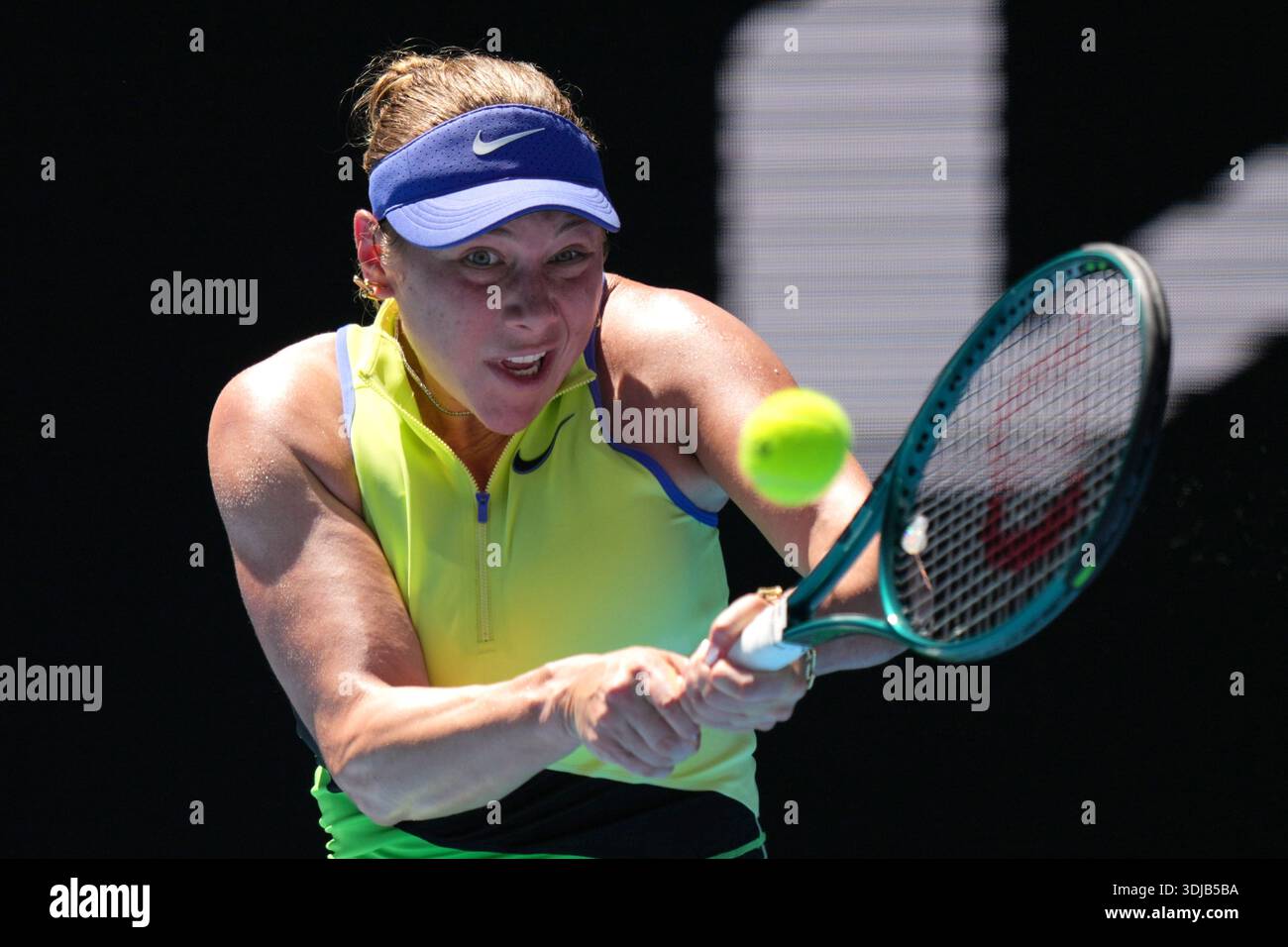 Amanda Anisimova of the U.S. plays a backhand return to Wang Xinyu of ...