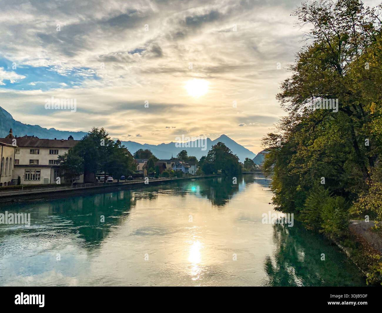 Setting sun behind river smartphone stock photos and images - Alamy