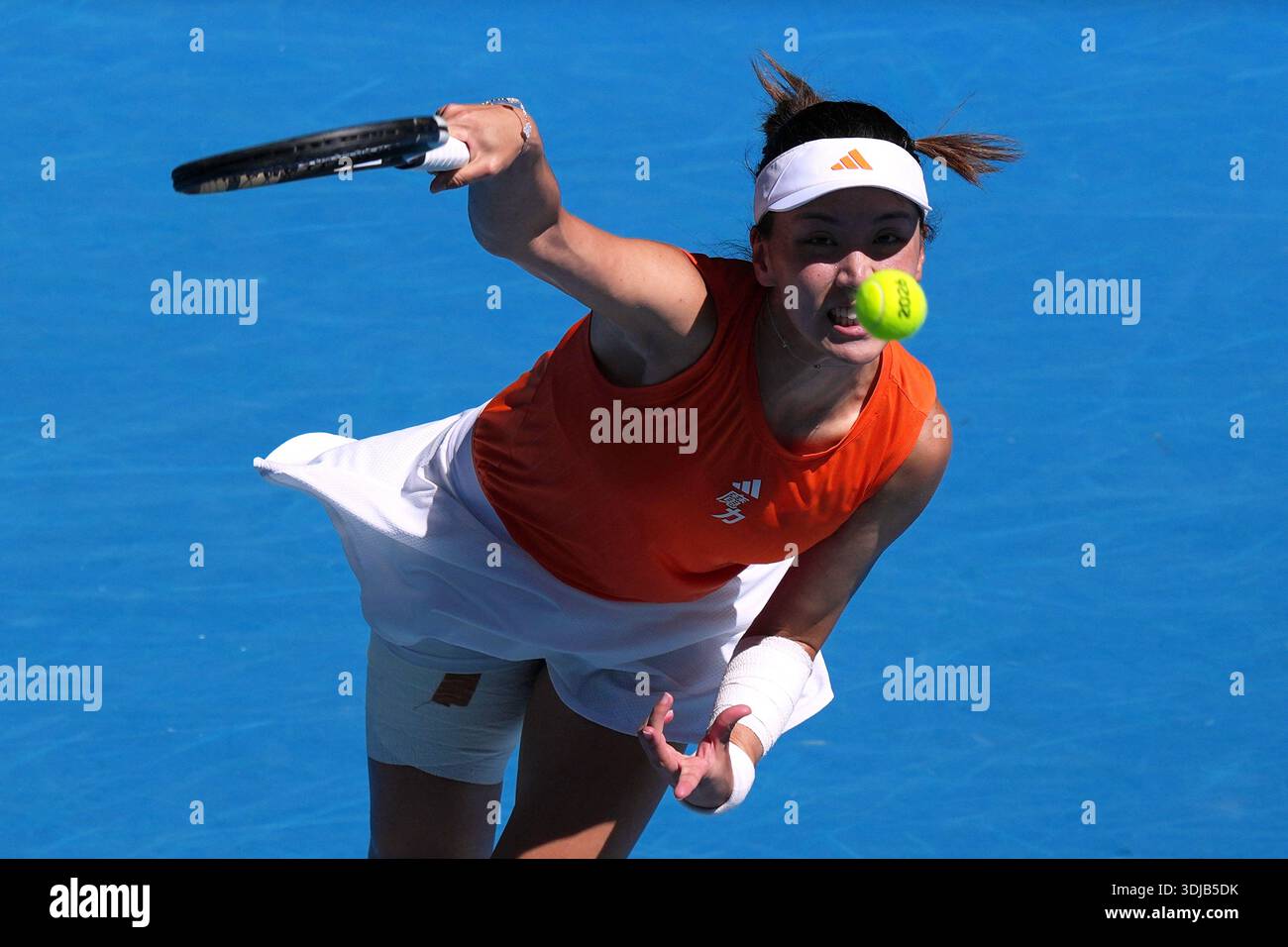 Wang Xinyu of China serves to Amanda Anisimova of the U.S. during their ...