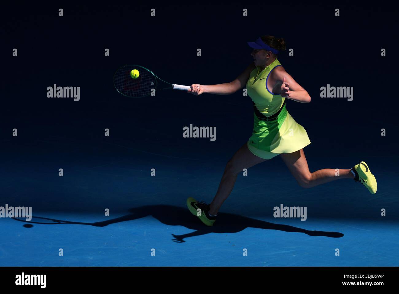 Amanda Anisimova of the U.S. plays a forehand return to Wang Xinyu of ...