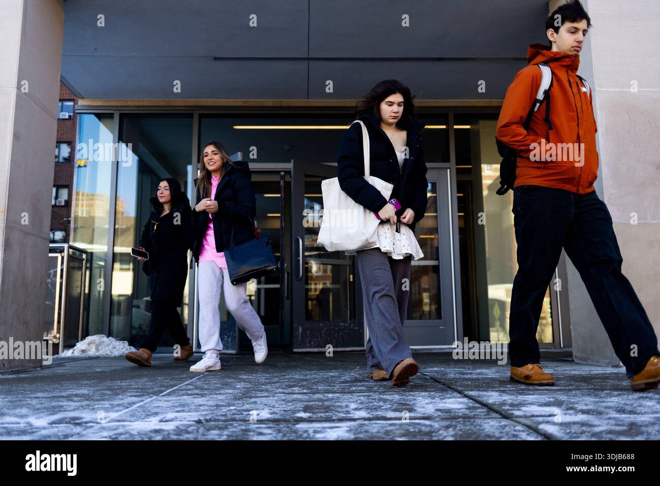 Students walk out of South Quad on the University of Michigan campus in ...