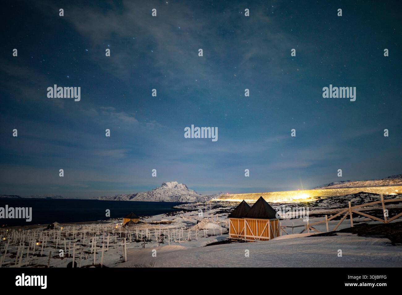 The night sky above huts and a graveyard in Nuuk, Greenland. Picture ...
