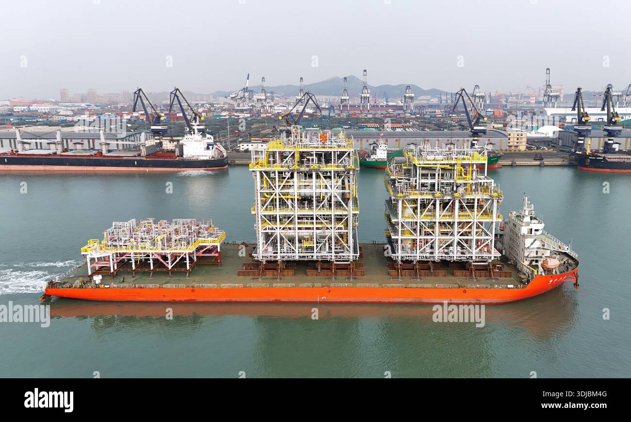 A deck barge carrying modules for a domestically built floating ...