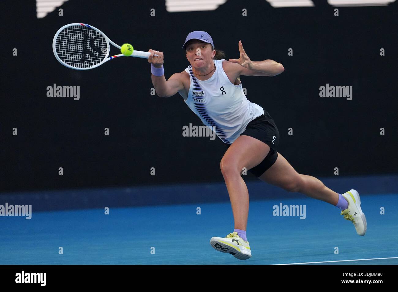 Iga Swiatek of Poland plays a forehand return to Maddison Inglis of ...