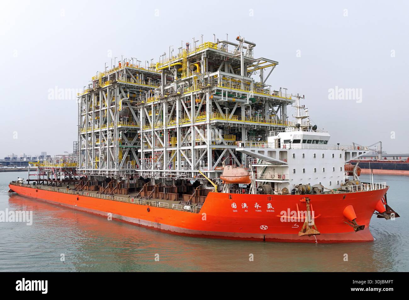 A deck barge carrying Chinese made floating production storage and ...